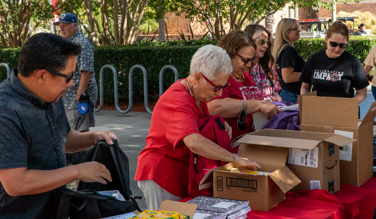 Chapman Staff Stuffs Backpacks for Local Students, Community Resource ...